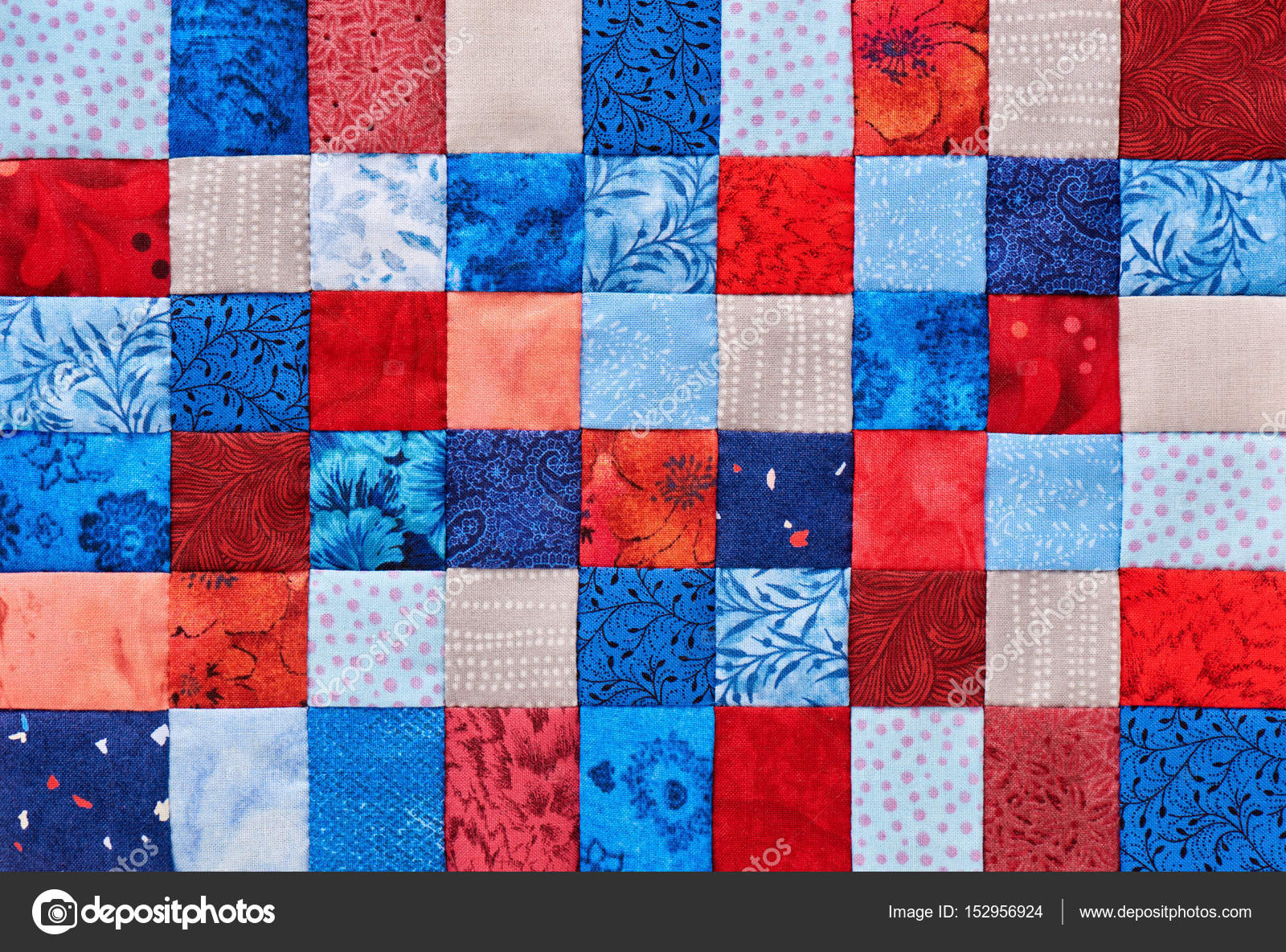 Blue and red square pieces of fabric sewn together Stock Photo by ...