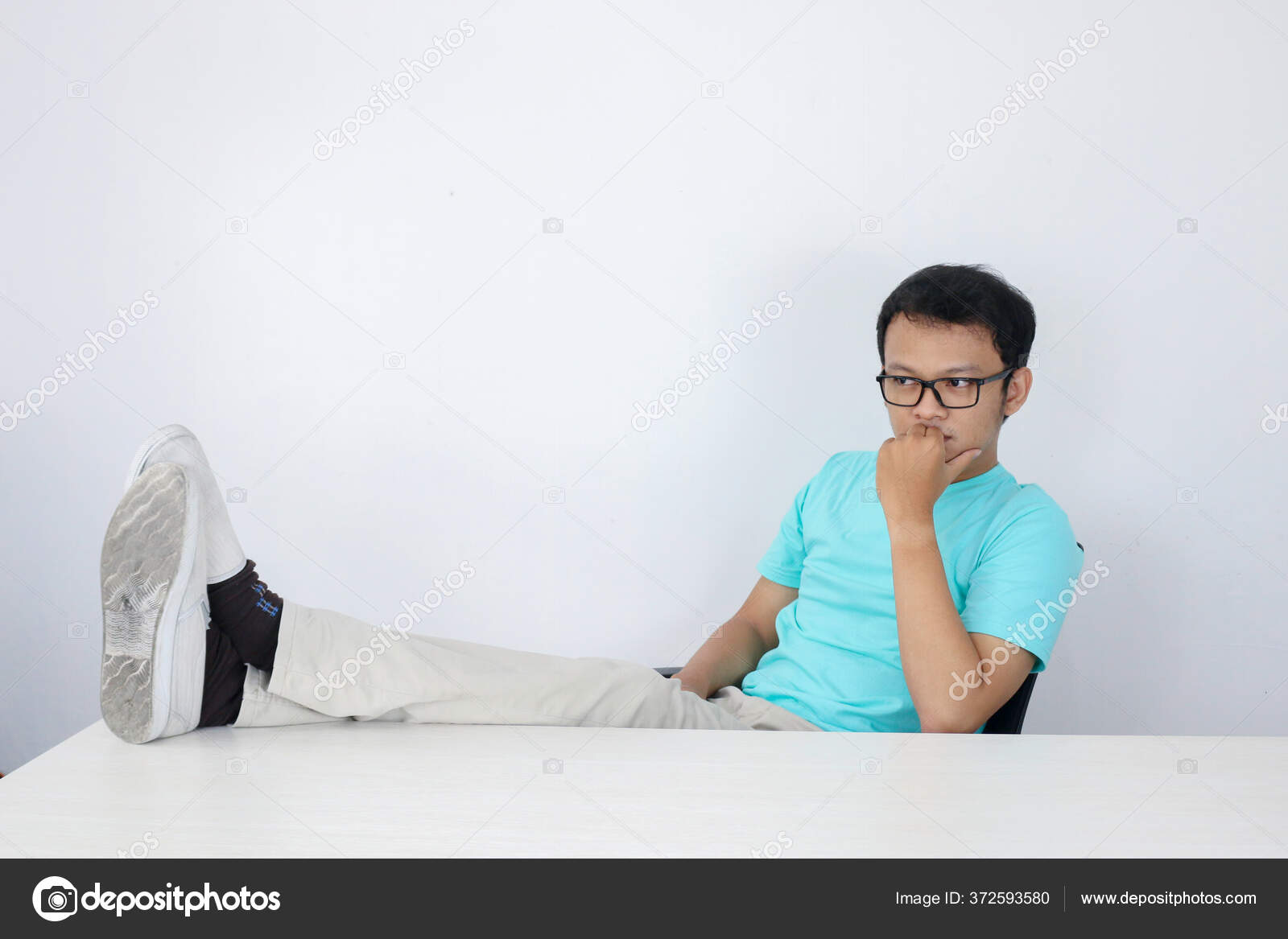 Young Asian Man Serious Focus Look Leg Table Arm Chin — Stock Photo ...