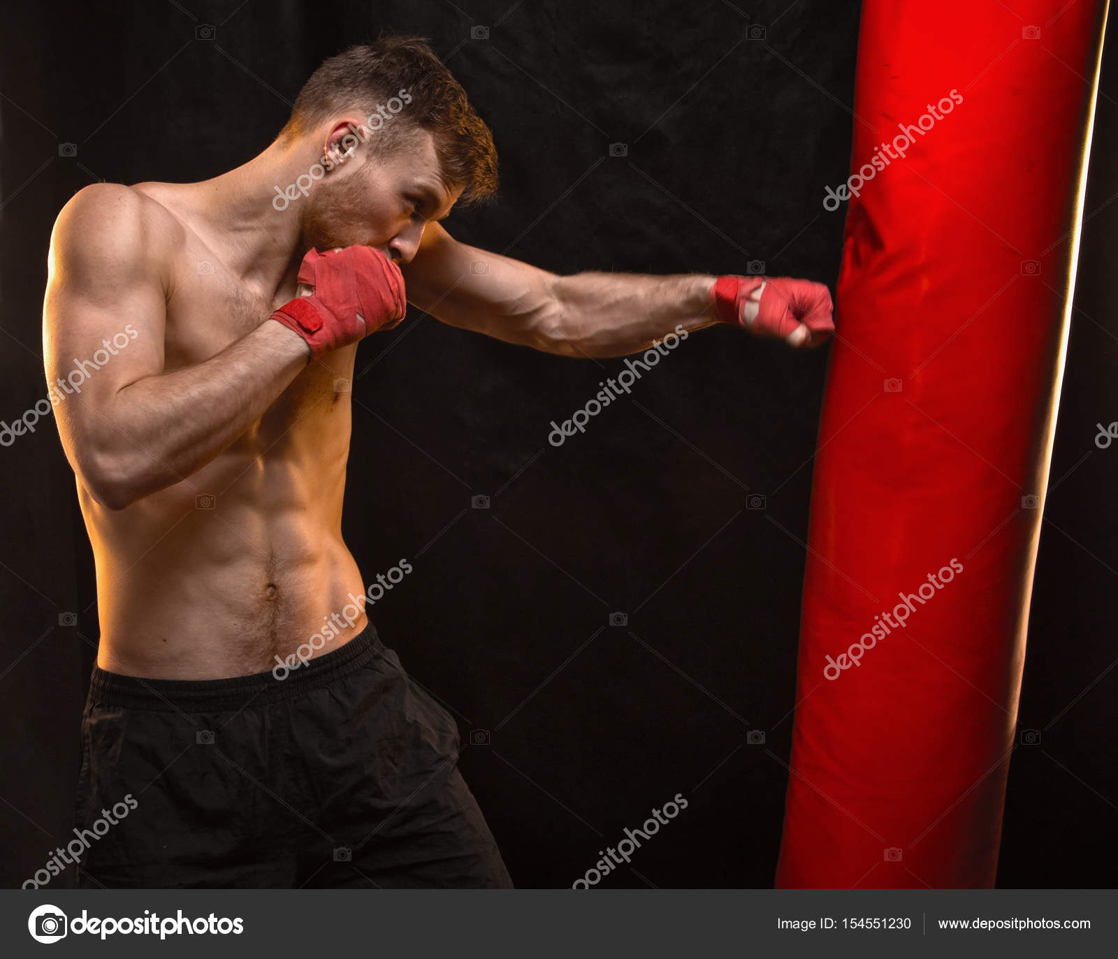 Fighter man and punching bag Stock Photo by ©ChrisTefme 154551230