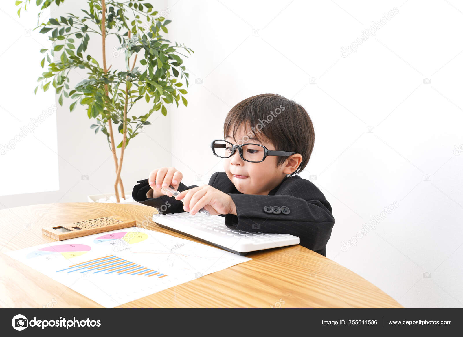 Little Boy Studying Sitting Desk Analyzing Graphs Stock Photo by ...