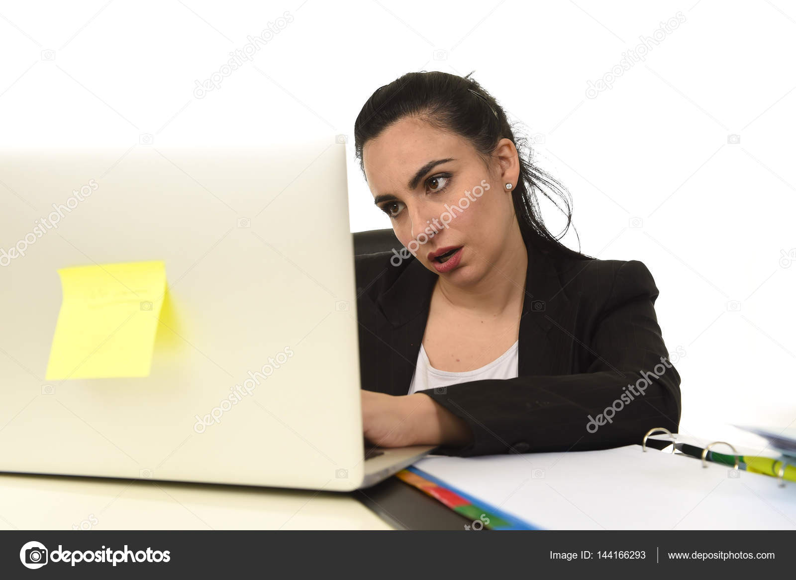 Attractive woman in business suit working tired and bored in office ...