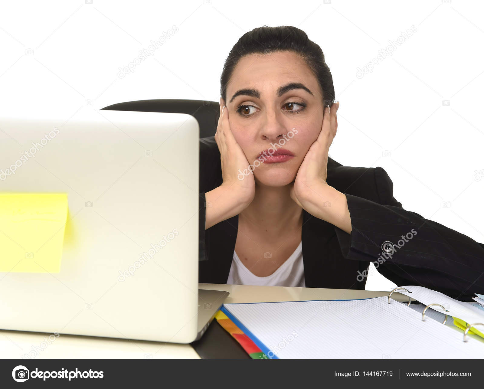 Attractive woman in business suit working tired and bored in office ...