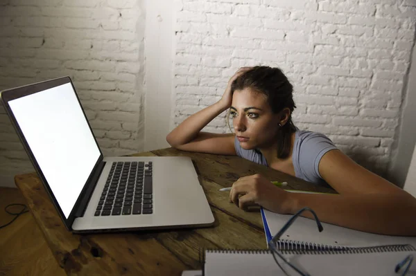 Young desperate university student girl in stress for exam studying ...