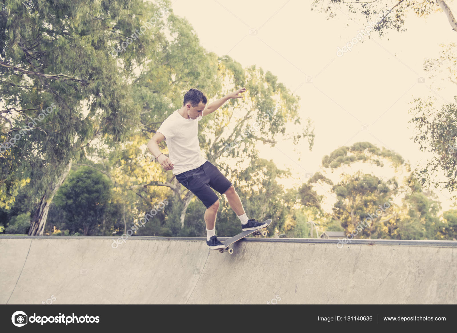 Man practicing radical skate board jumping and enjoying tricks and ...