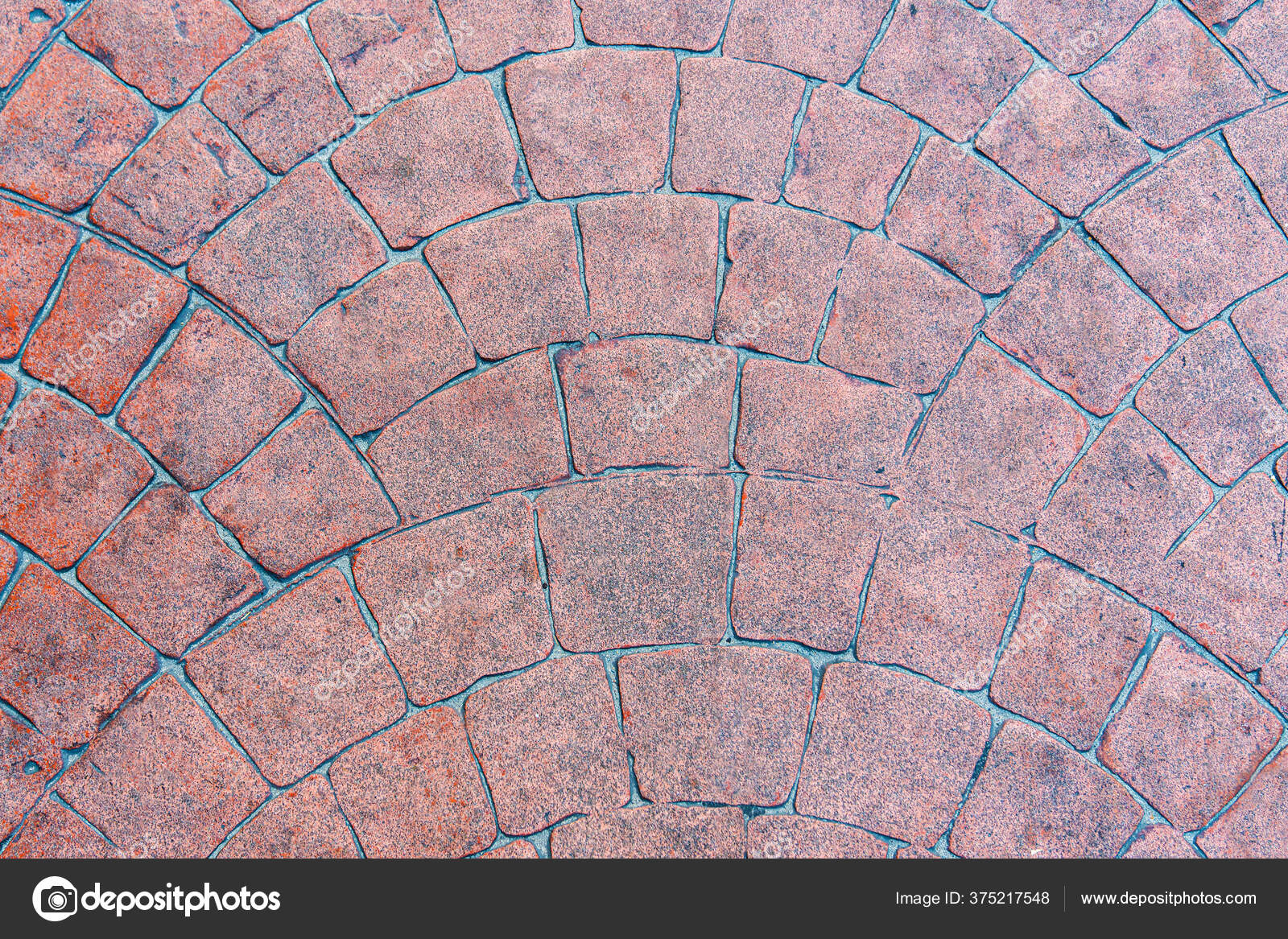 Stone paving stones are red. texture background, old paving, top view ...