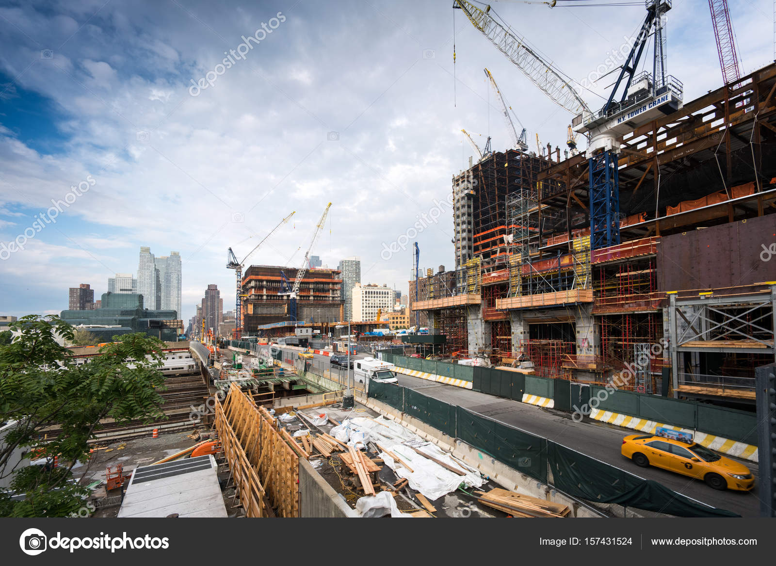 Construction site with incomplete buildings and cranes Stock Photo by ...