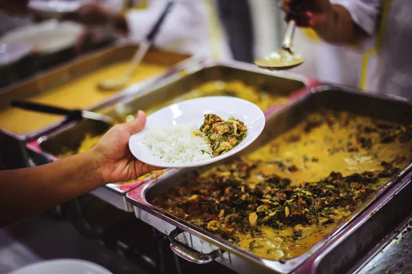 The beggars receive food from the help of the generous in society: the ...