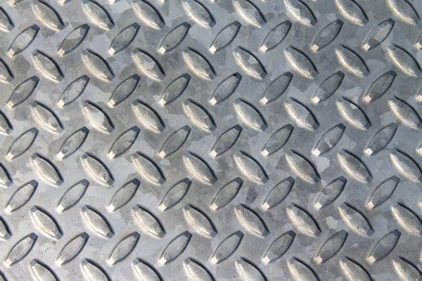A metal background or texture with tread plate pattern Stock Photo by ...
