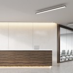 Front view of reception desk in long sunlit corridor Stock Photo by ...