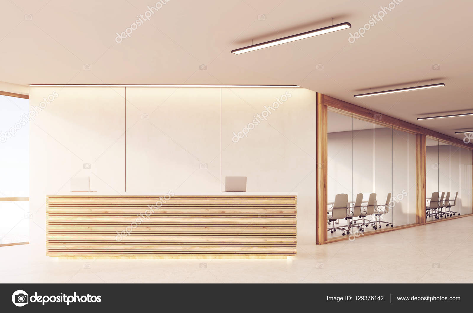 Front view of reception desk in long sunlit corridor Stock Photo by ...