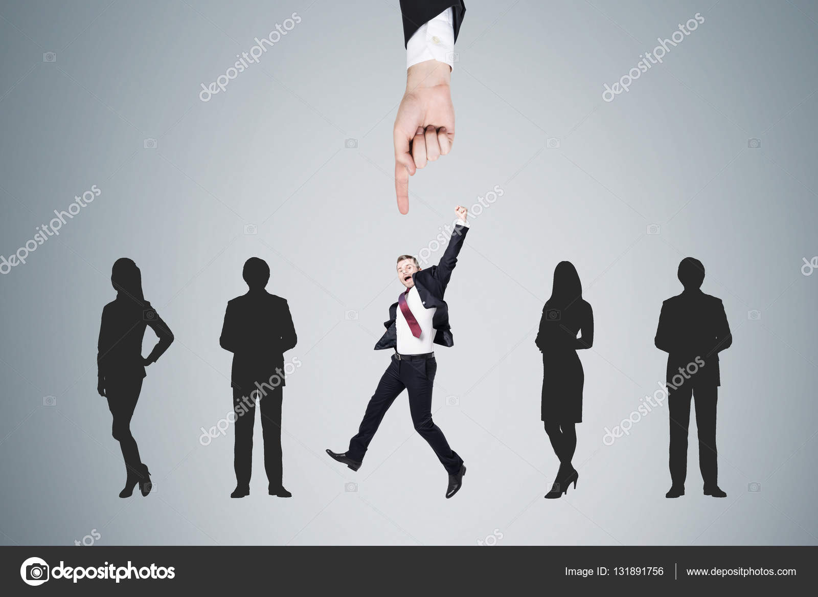 Large hand picking up people near a gray wall Stock Photo by ...