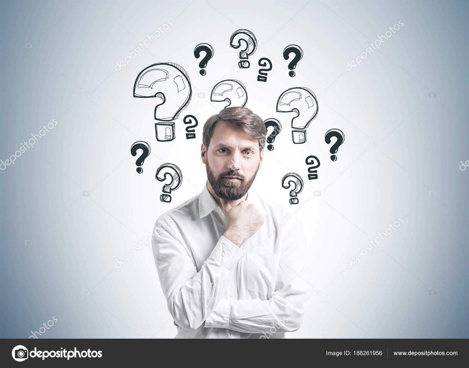 Confident young businessman, question marks Stock Photo by ...
