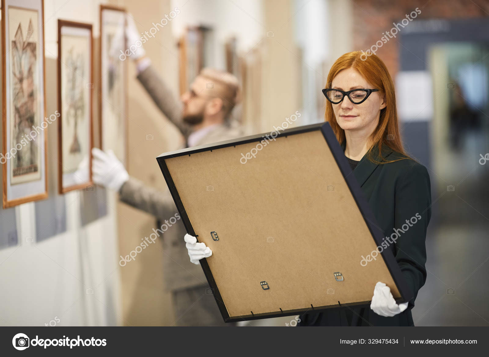 Art manager standing with painting Stock Photo by ©annas.stills.gmail ...