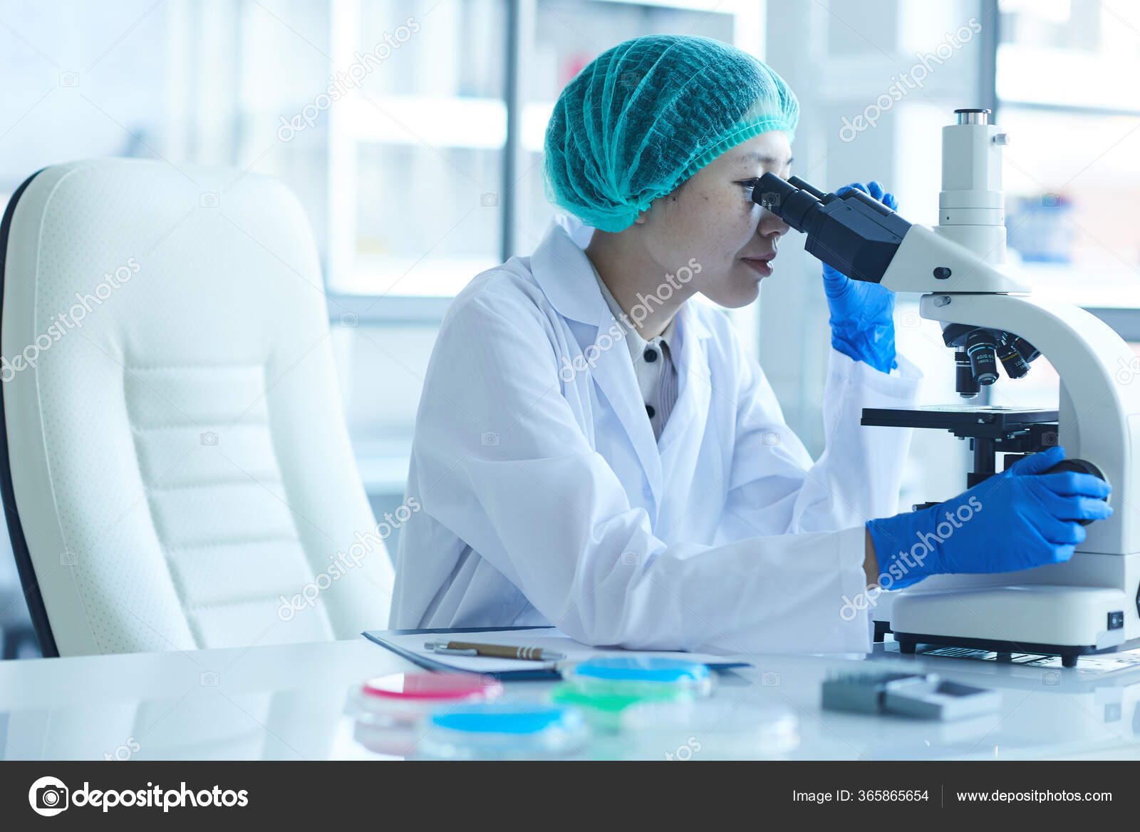 Woman working with microscope in the lab — Stock Photo © annas.stills ...