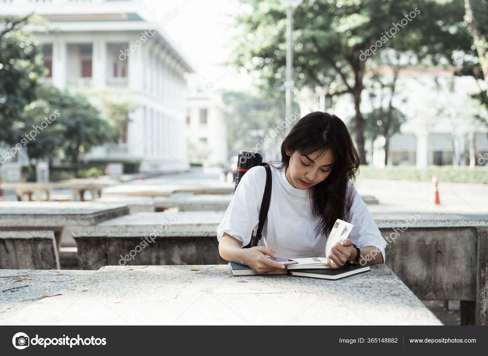 Girl Sitting Alone On Bench Reading