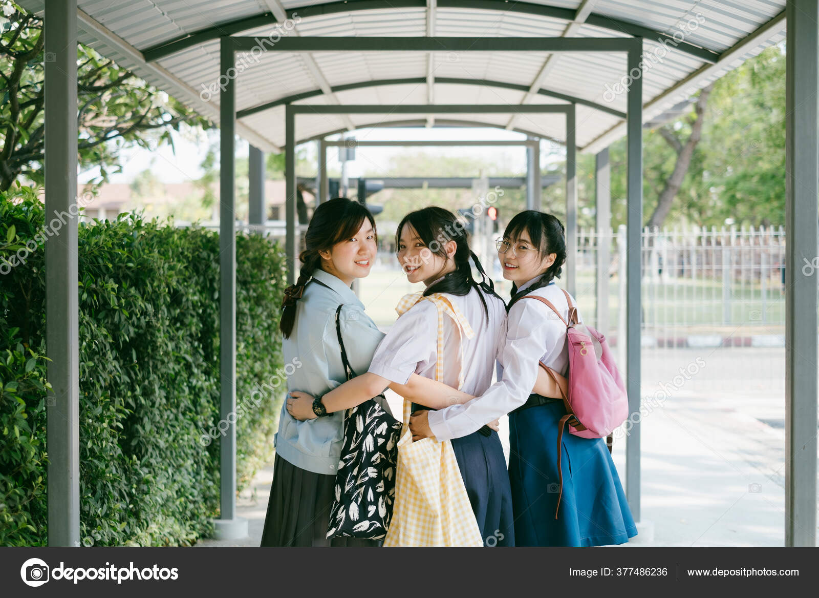 Three Students Hugging Each Other Looking Back Camera — Stock Photo ...