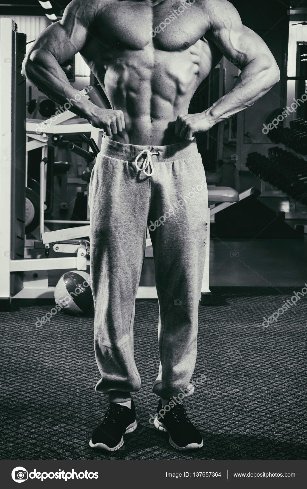 A very strong man is engaged in the gym — Stock Photo © aallm #137657364