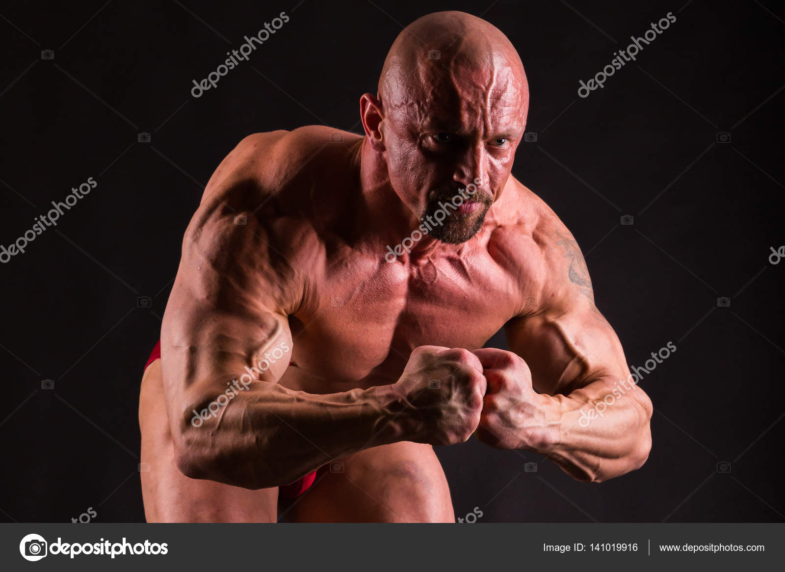 Bodybuilder posing in different poses demonstrating their muscle Stock ...