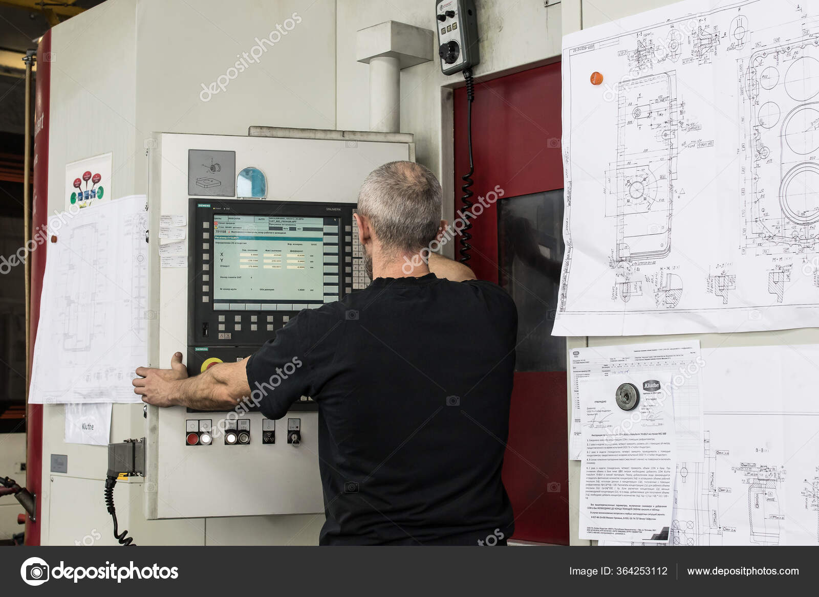 Programmer Sets Software Controlled Machine Processing Automobile Parts ...