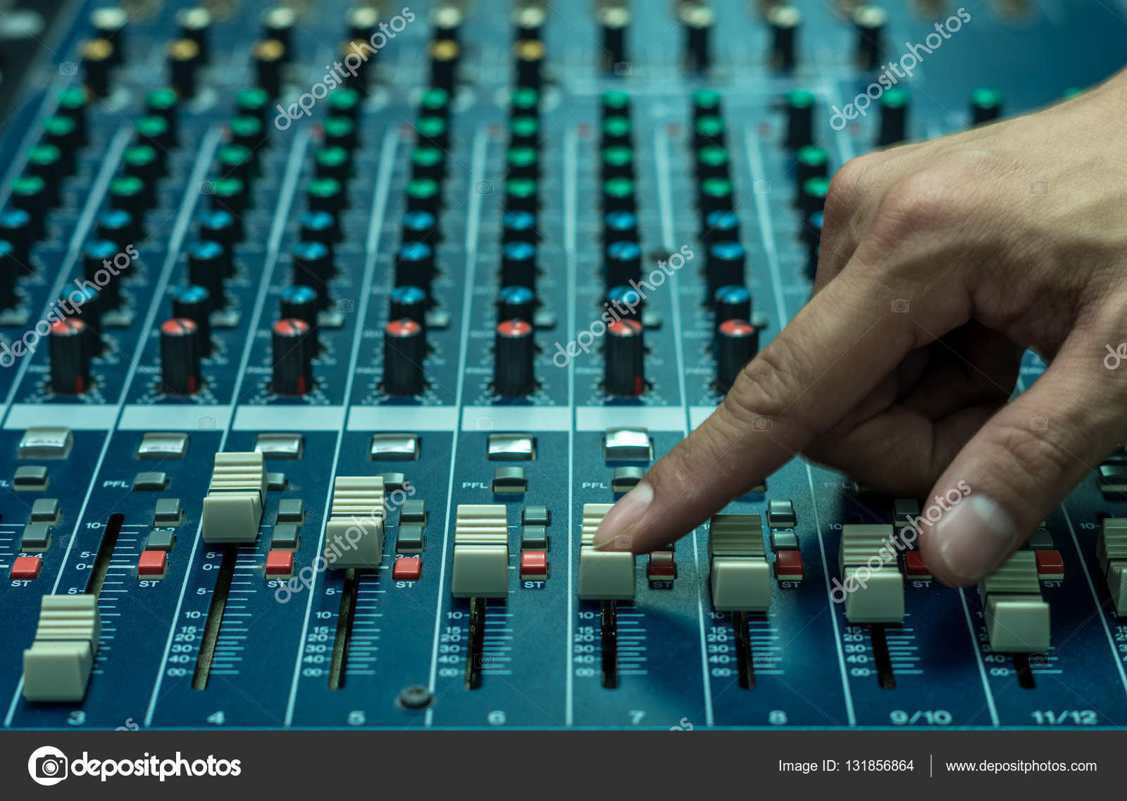 Hand adjusting audio mixer — Stock Photo © Tzido #131856864