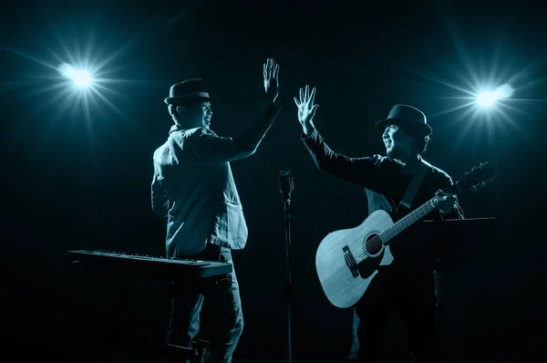Musician Duo band playing Stock Photo by ©Tzido 155275022