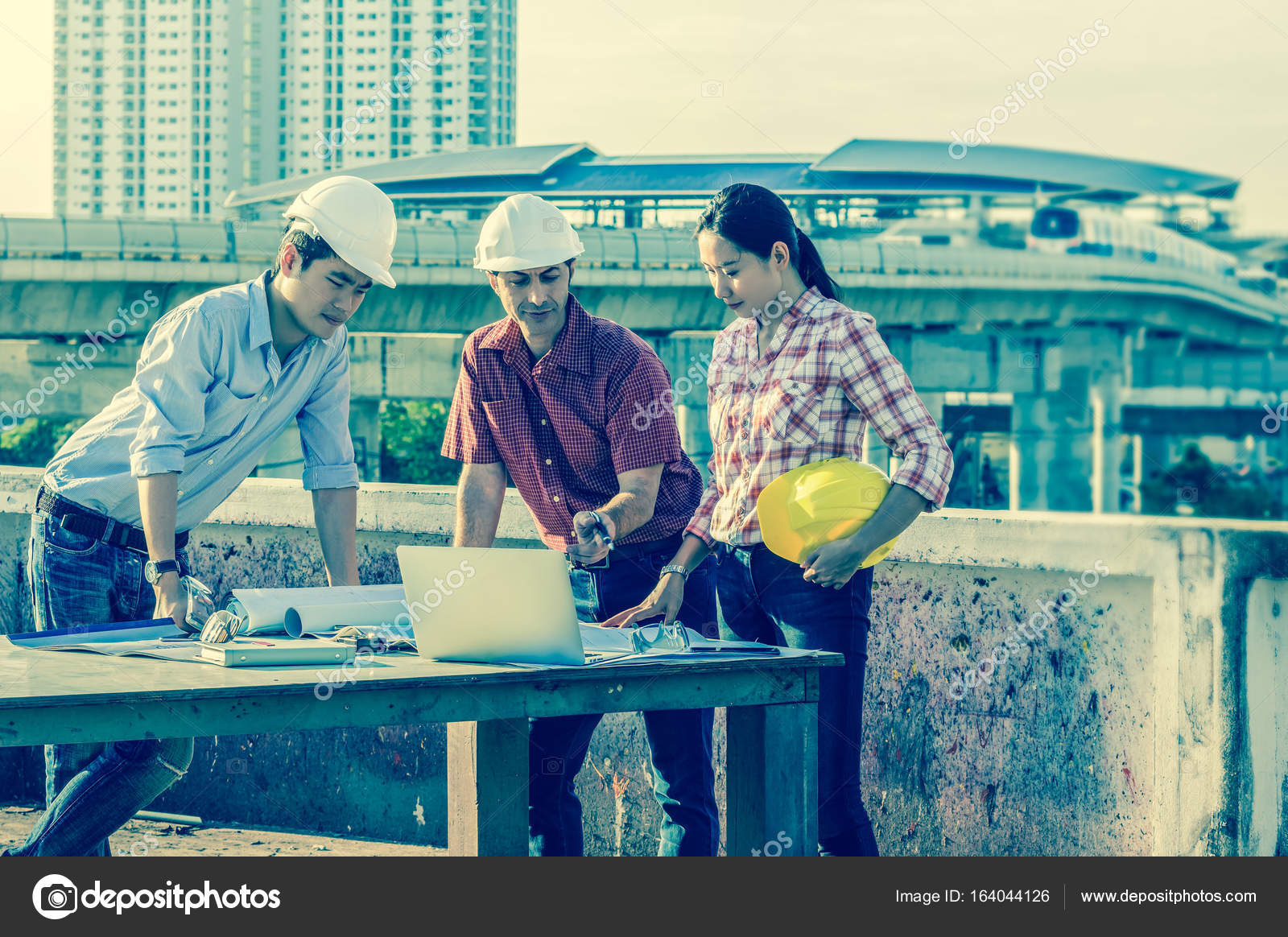 Group of professional engineers with blueprints Stock Photo by ©Tzido ...