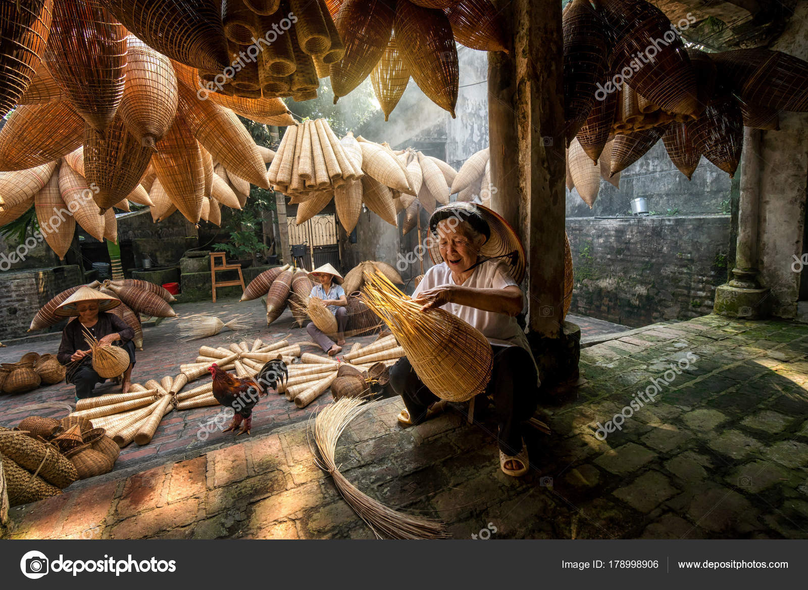 Old Vietnamese Female Craftsman Making Traditional Bamboo Fish Trap ...