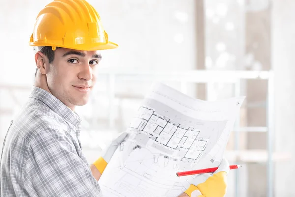 Architect or structural engineer with blueprint Stock Photo by ...