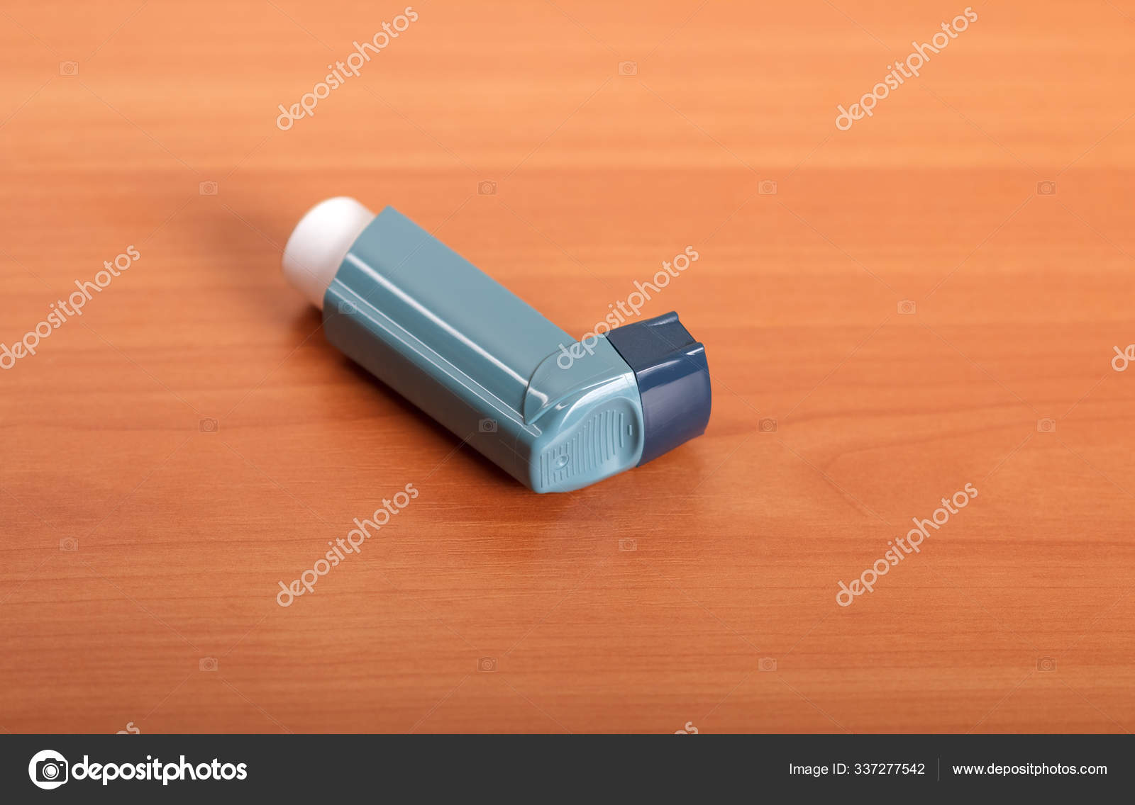 Small pocket inhaler on the background of table Stock Photo by ©Laboko ...