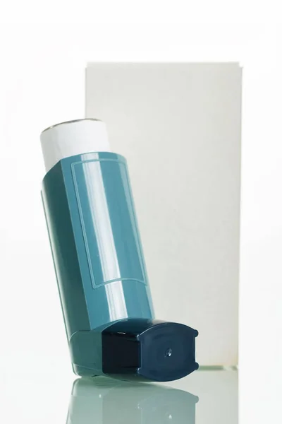 Orange asthma inhaler isolated on white — Stock Photo © Laboko #340073934