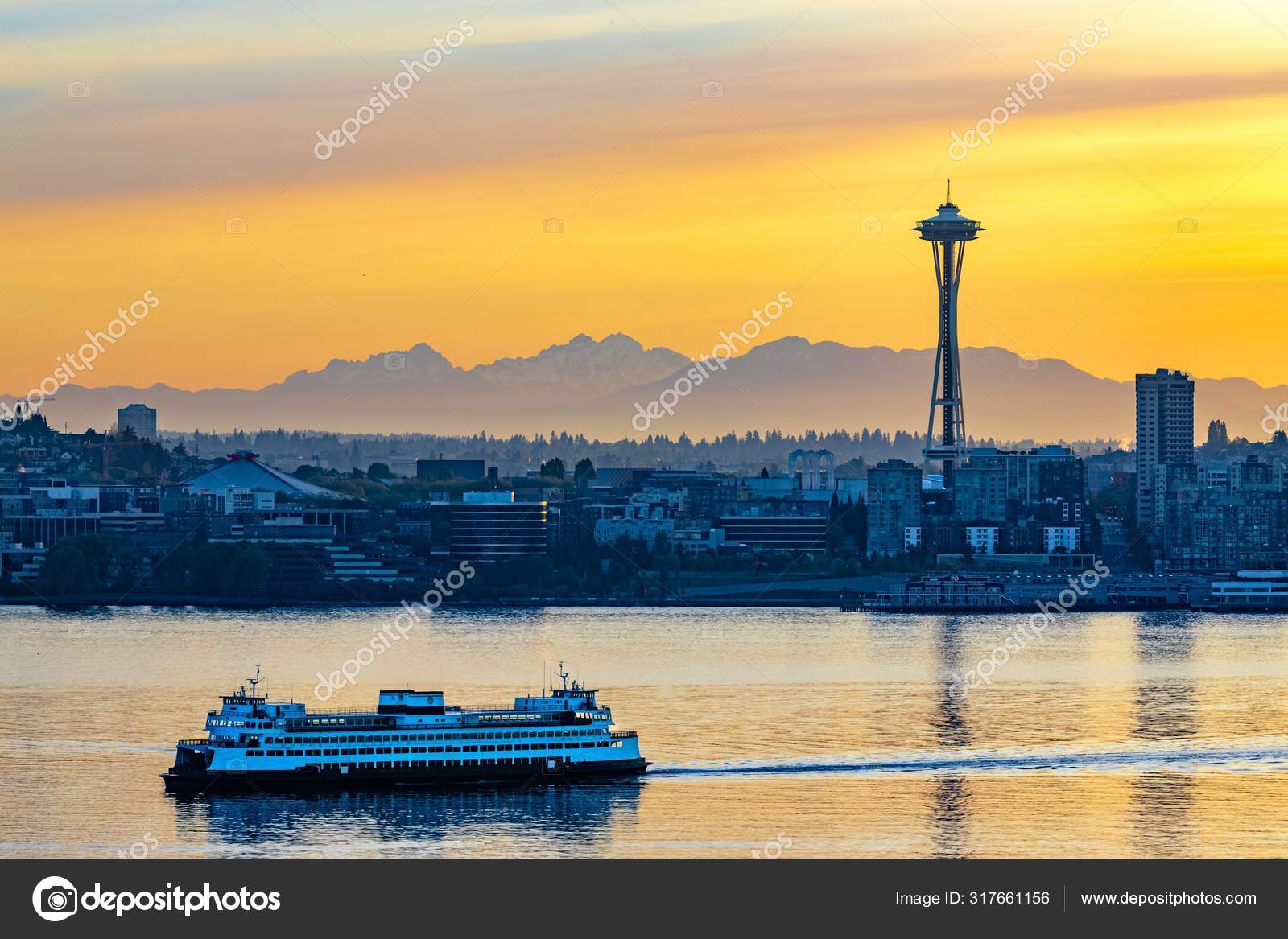 Ferry on the water with the city of Seattle, USA under the beautiful ...