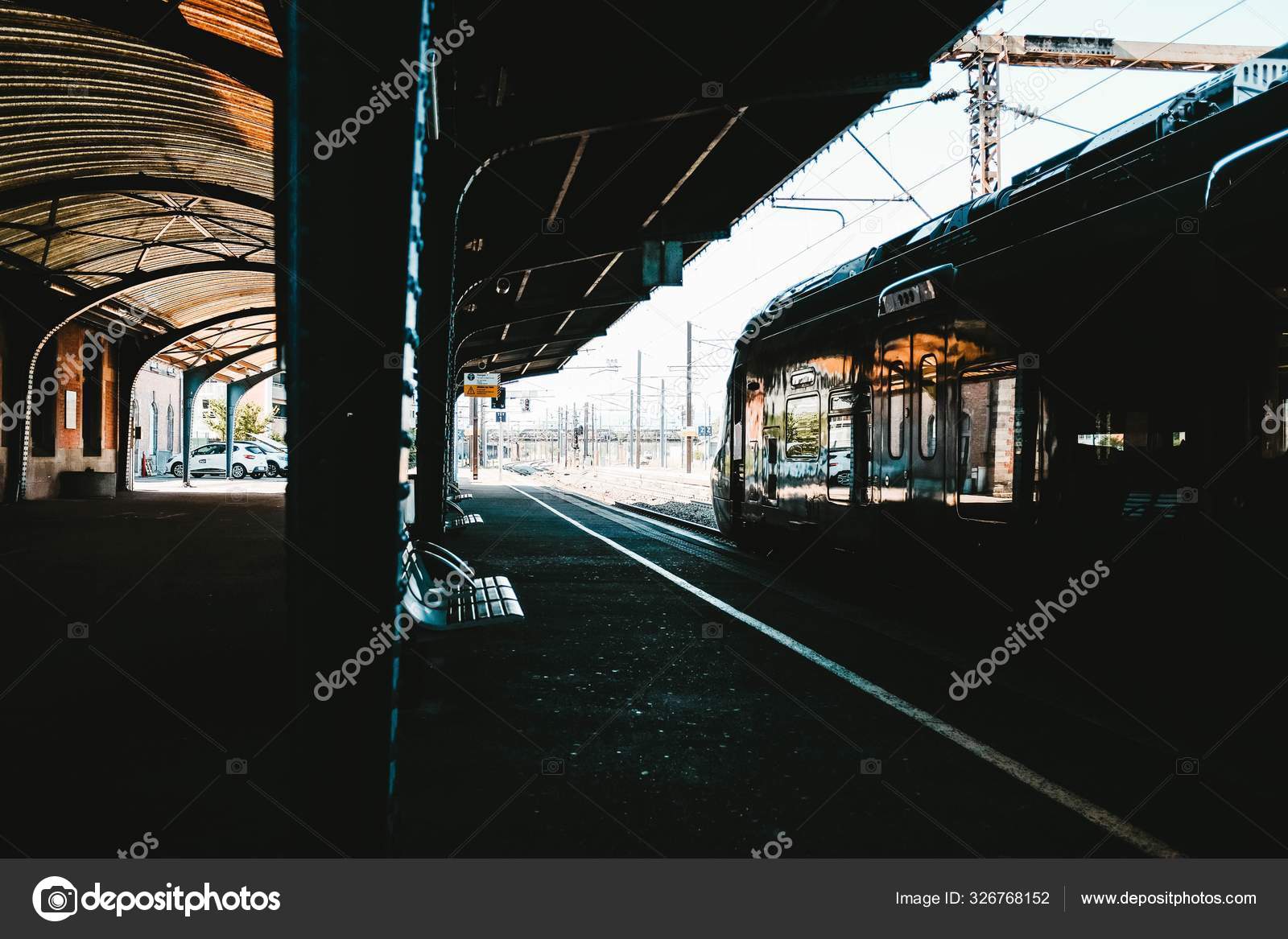 Train in an empty train station captured during day time Stock Photo by ...