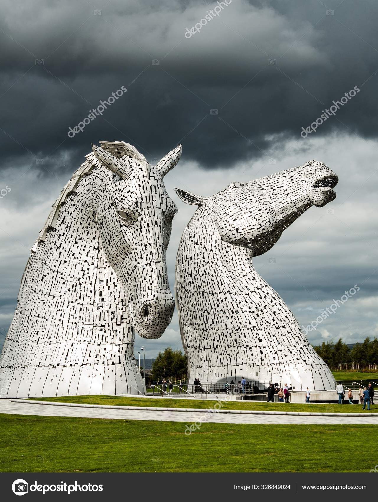 Pair of high modern buildings of horses under a cloudy sky in Falkirk ...