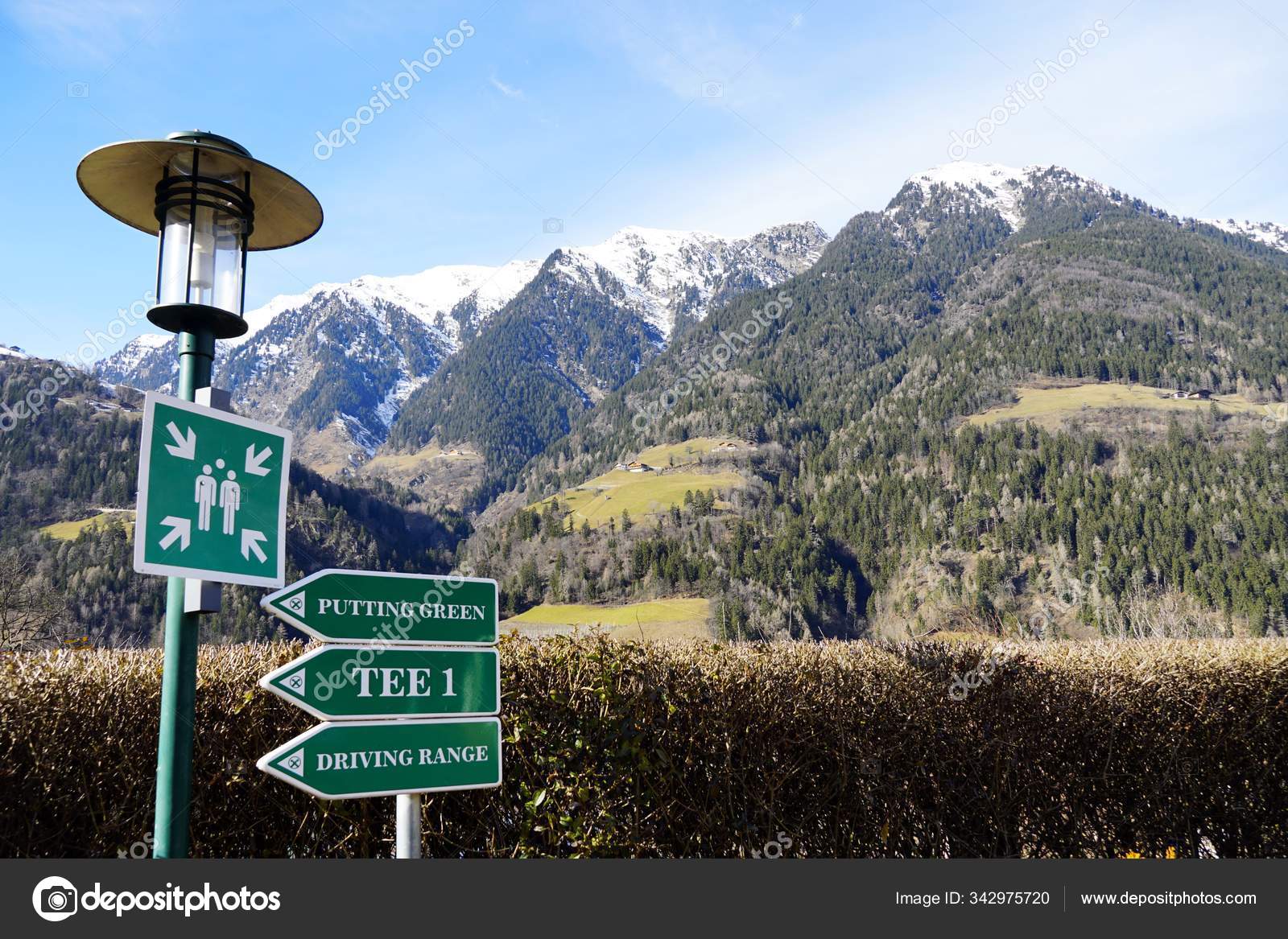 Golf resort signs indicating assembly point and directions with ...