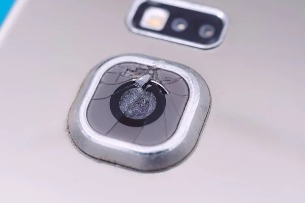 Cracked smartphone camera closeup. Damage after the phone fell to the ...