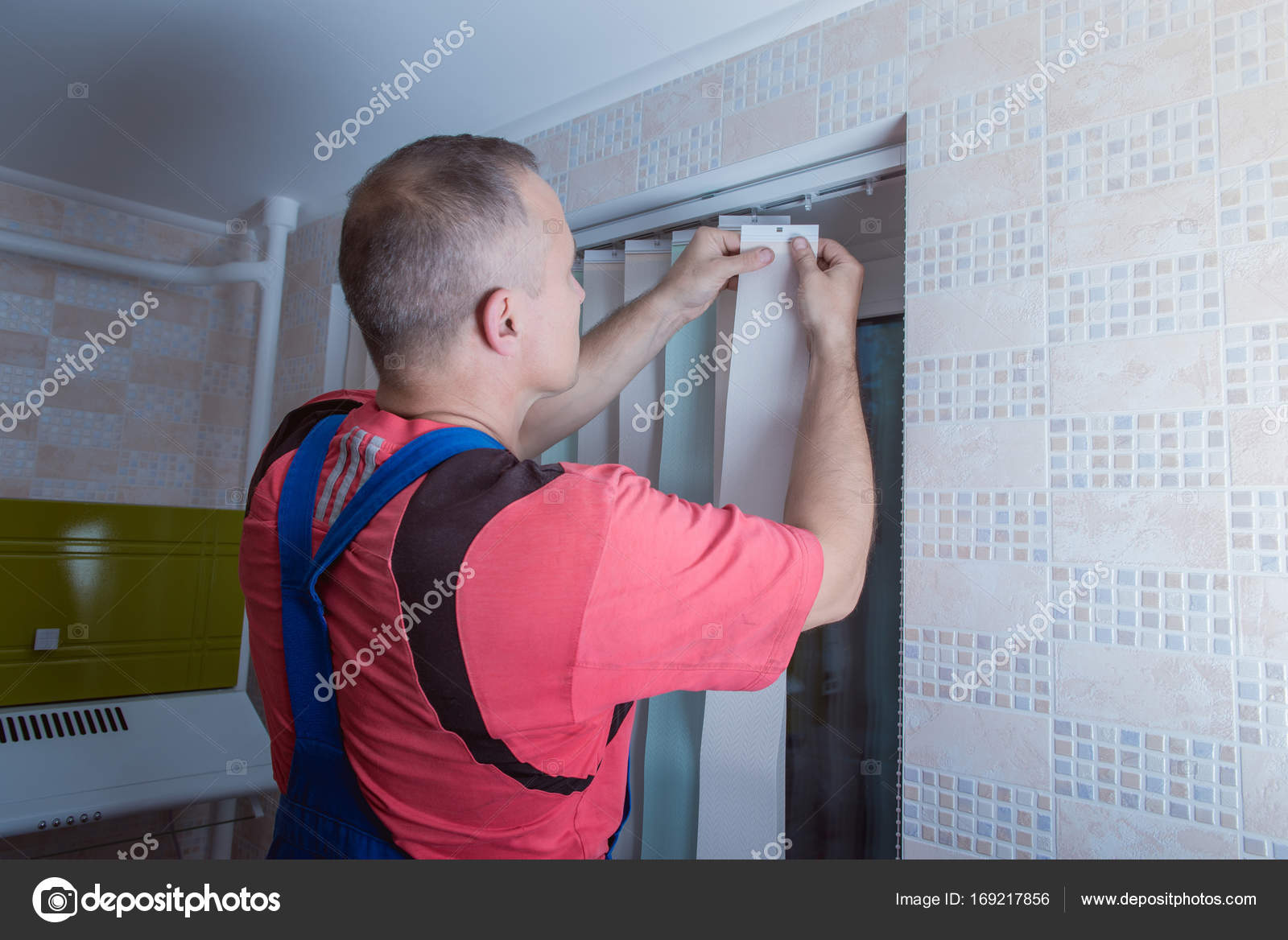 Man is installing window blinds, Stock Photo by ©nata-lunataD 169217856