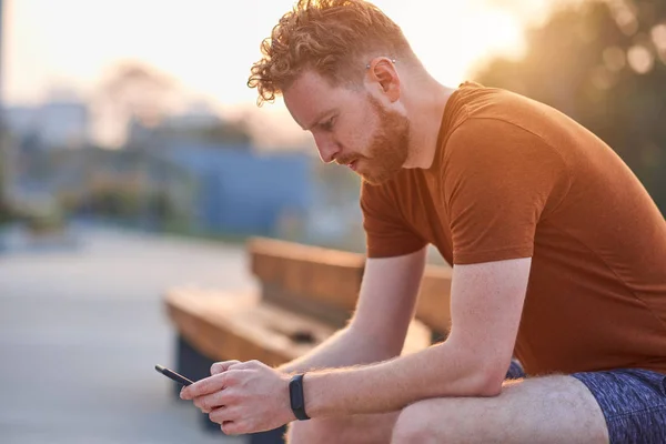 Man using cellphone in urban area at summer time. - Stock Image ...