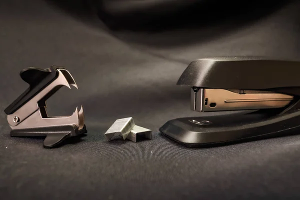 Stapler verses staple remover Office conflict example - Stock Image ...