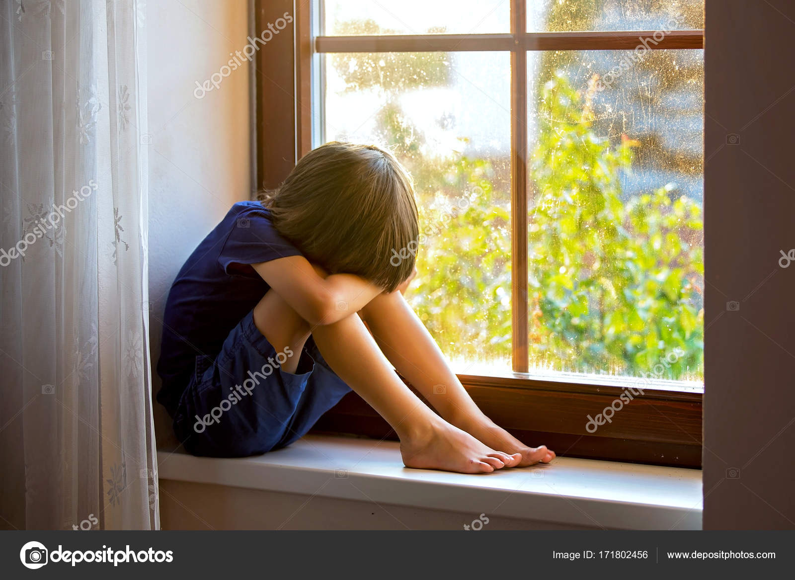 Sad child, boy, sitting on a window shield Stock Photo by ©t.tomsickova ...