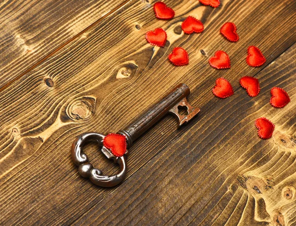 'Key to My Heart' love concept, with gold heart shape key and red heart ...