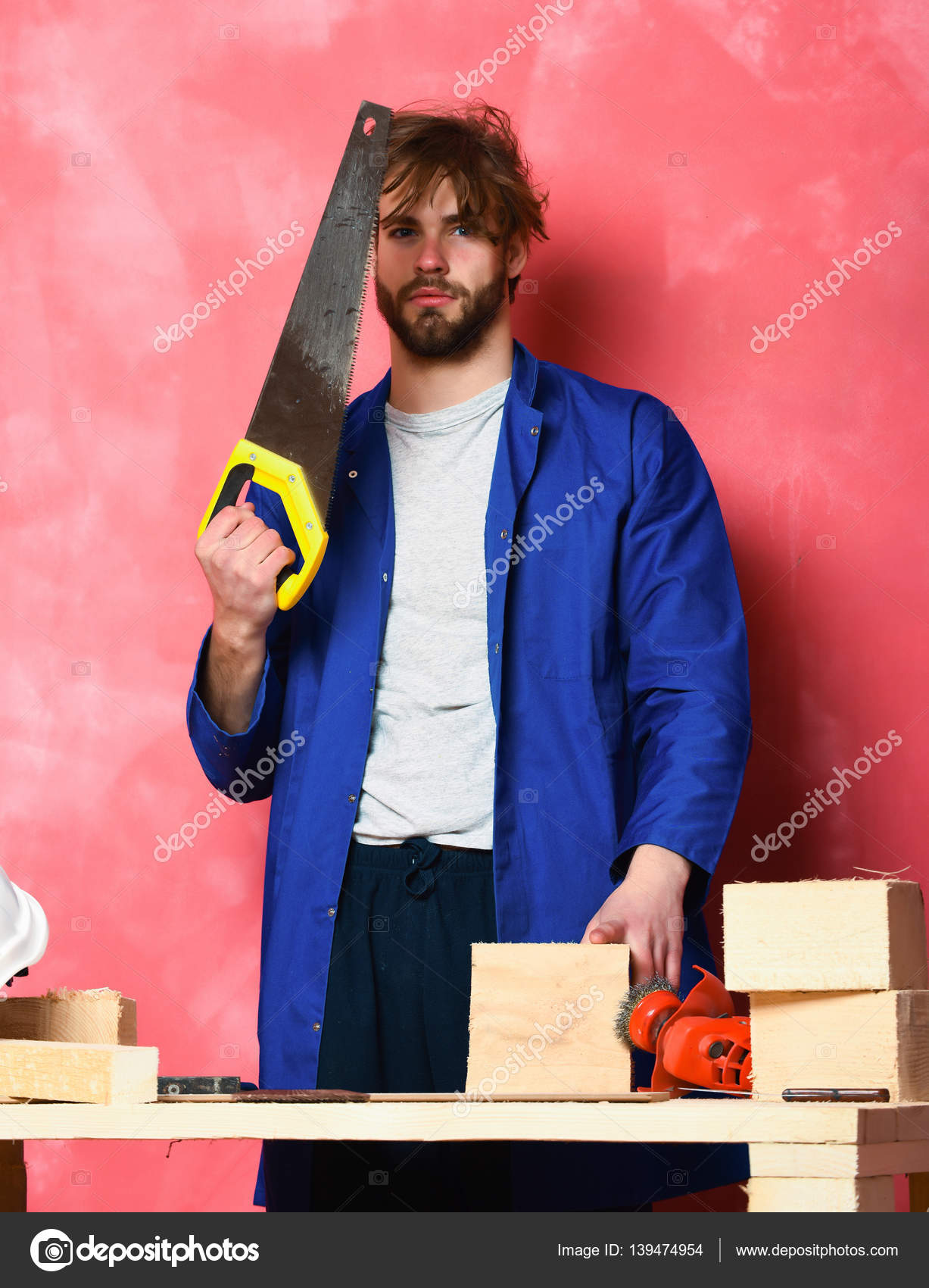 Builder man holding saw — Stock Photo © stetsik #139474954