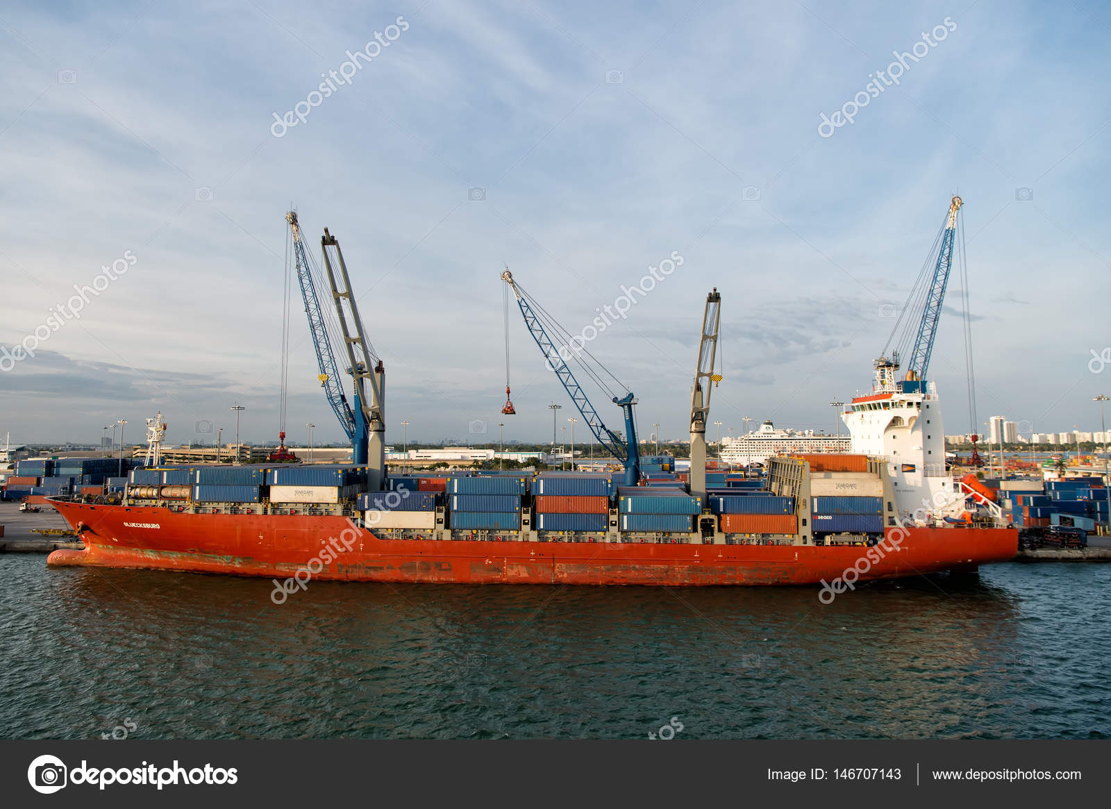 Big cargo ship or barge with many shipping container in bay with ...