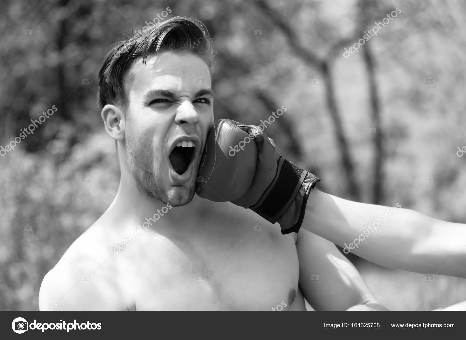 Man punched in face with boxing glove — Stock Photo © stetsik #164325708