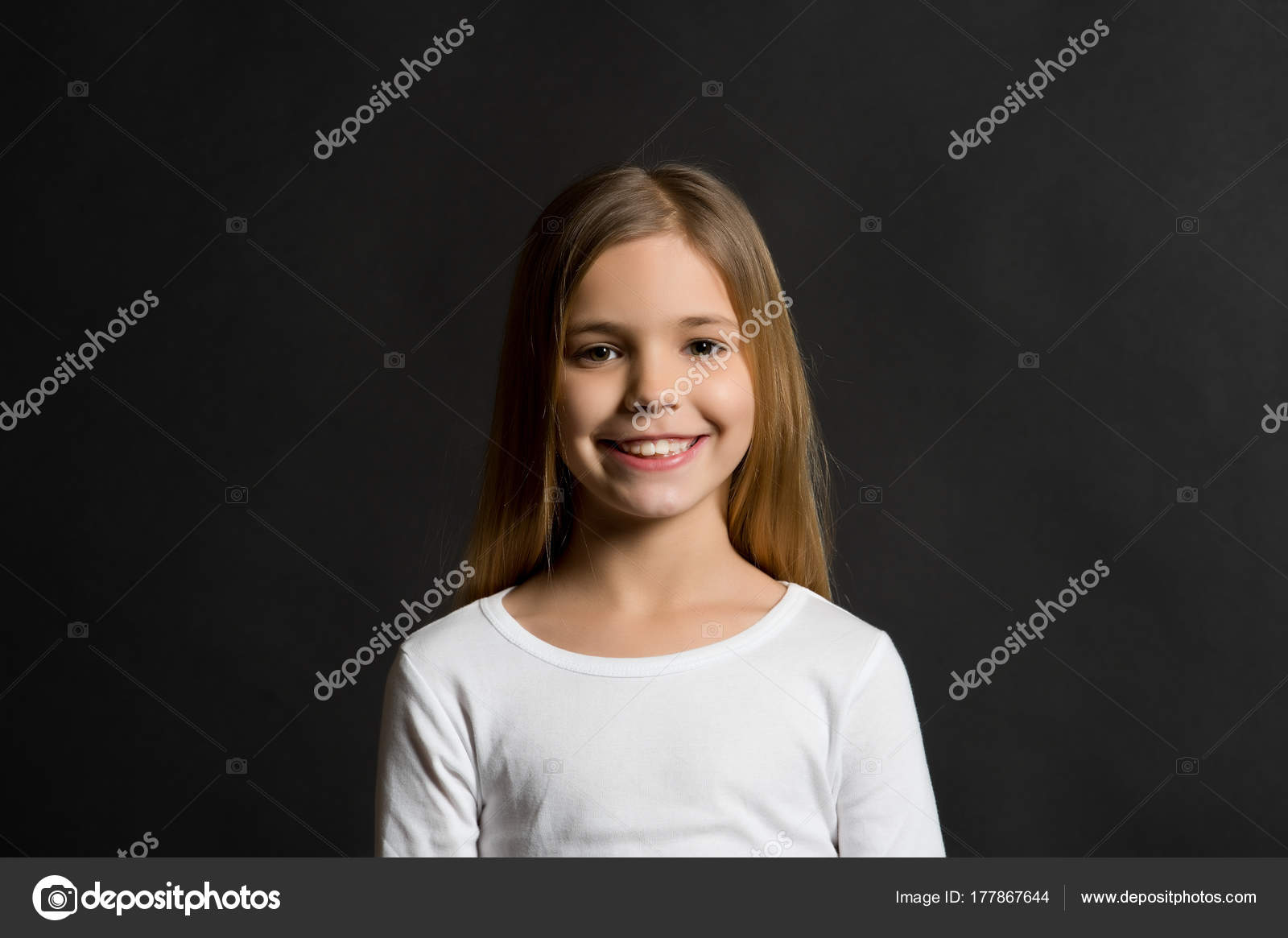 Kid model smiling with long healthy hair Stock Photo by ©stetsik 177867644