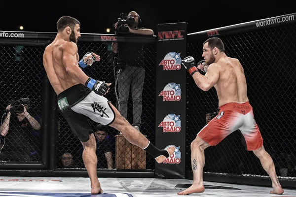 Mma fighters fight at the ring – Stock Editorial Photo © stetsik #180583728