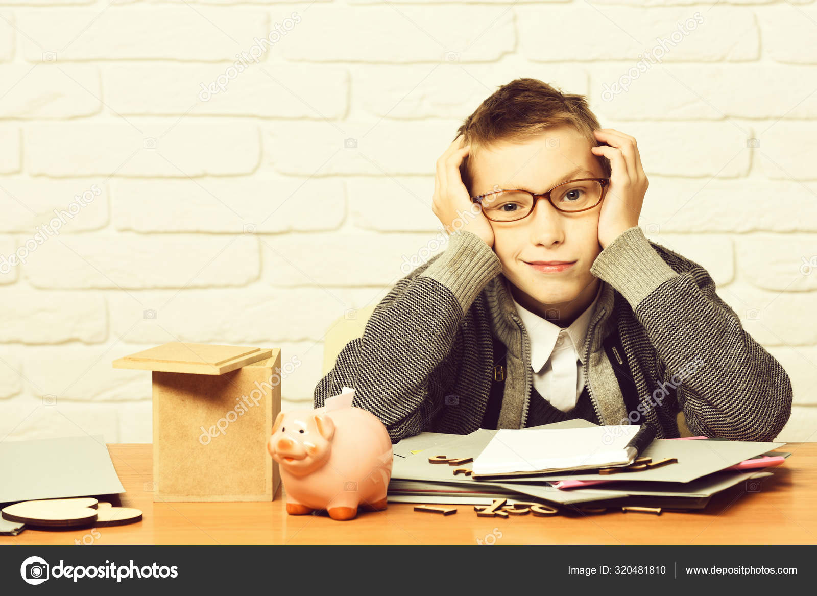 Young cute little pupil boy Stock Photo by ©stetsik 320481810