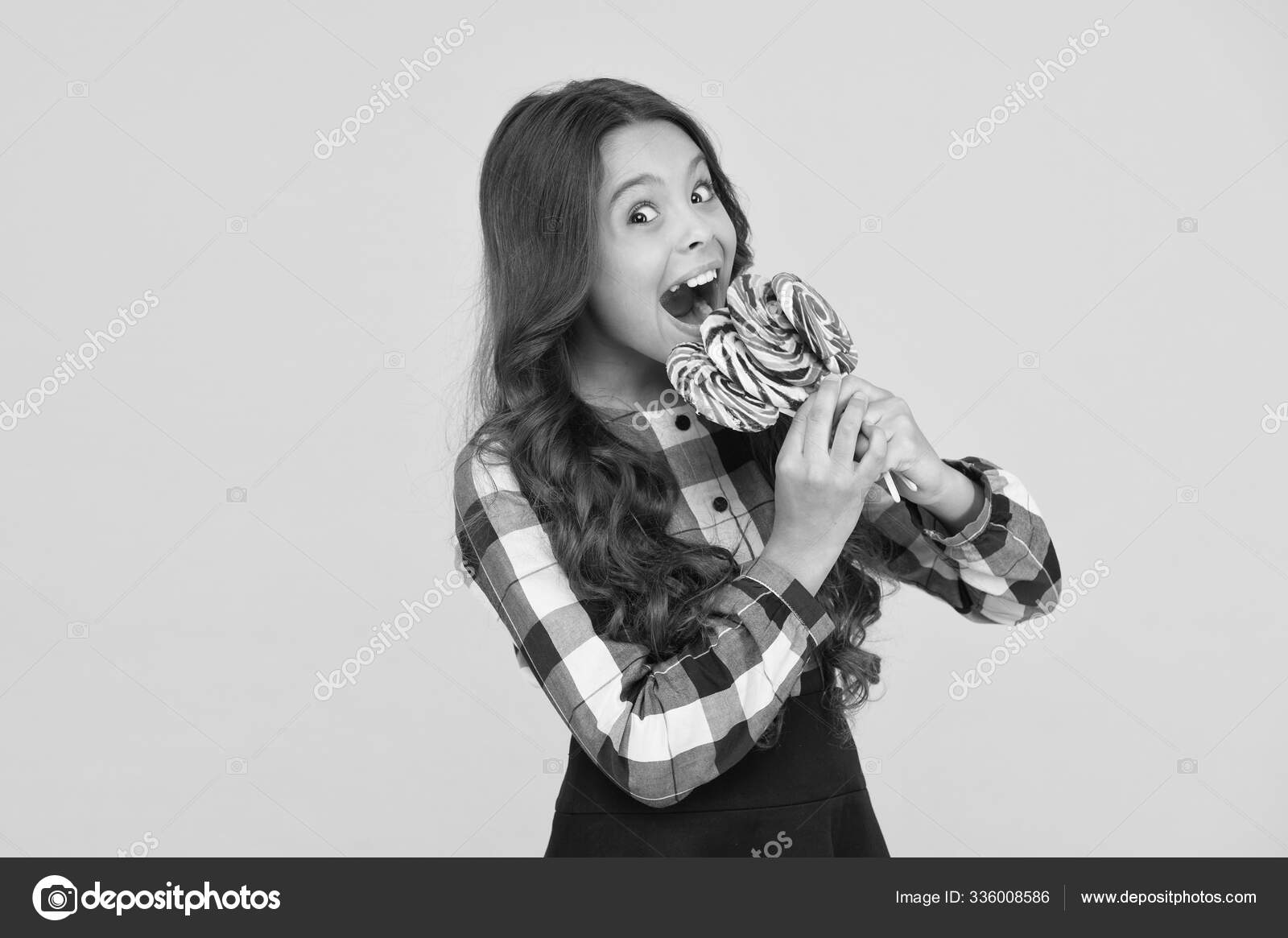 Crazy about sweets. Sugar addiction. Happy kid with sweet candy. Kid ...