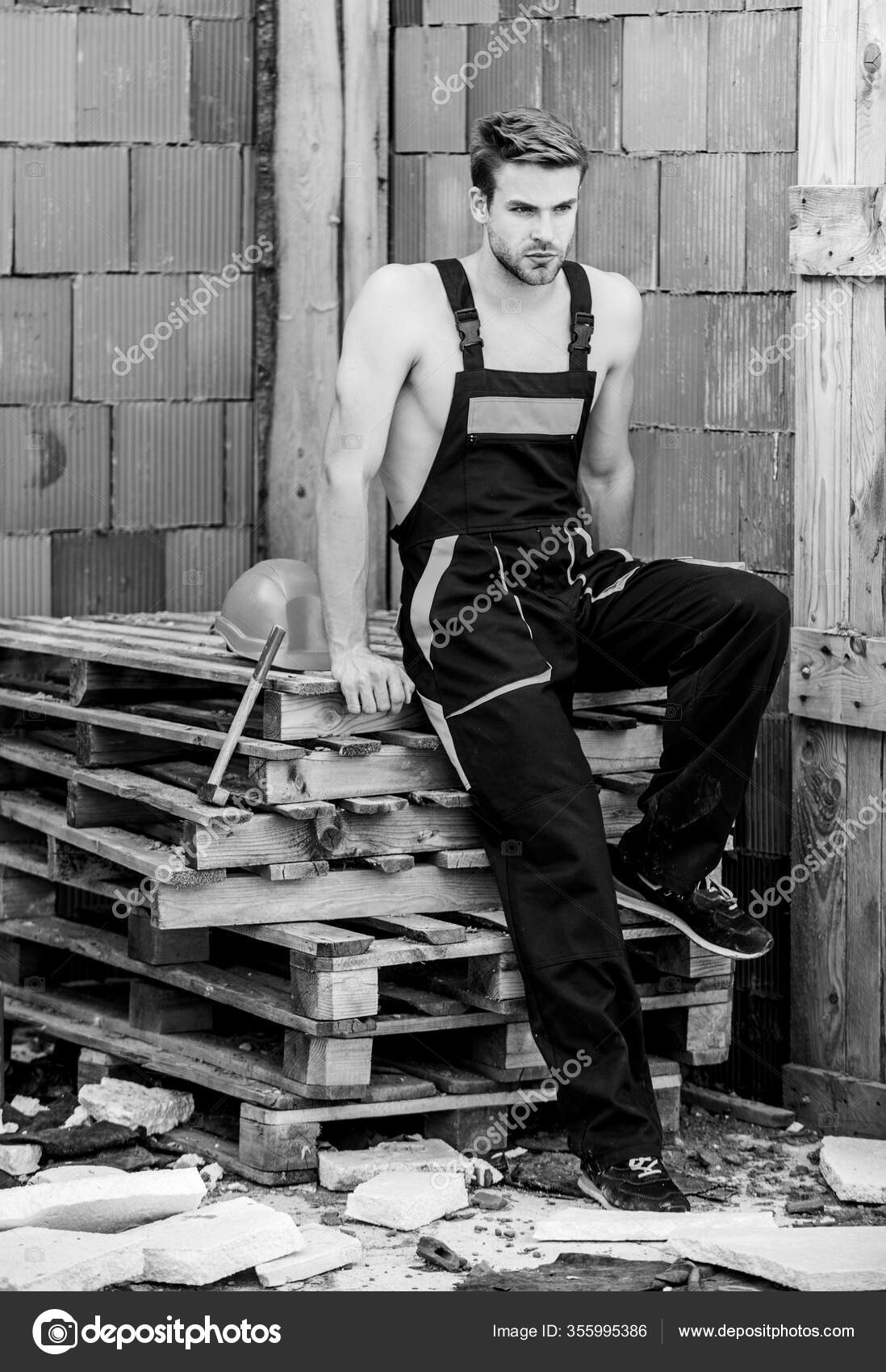 Sexy laborer. Building construction. Worker brick wall background. Man ...