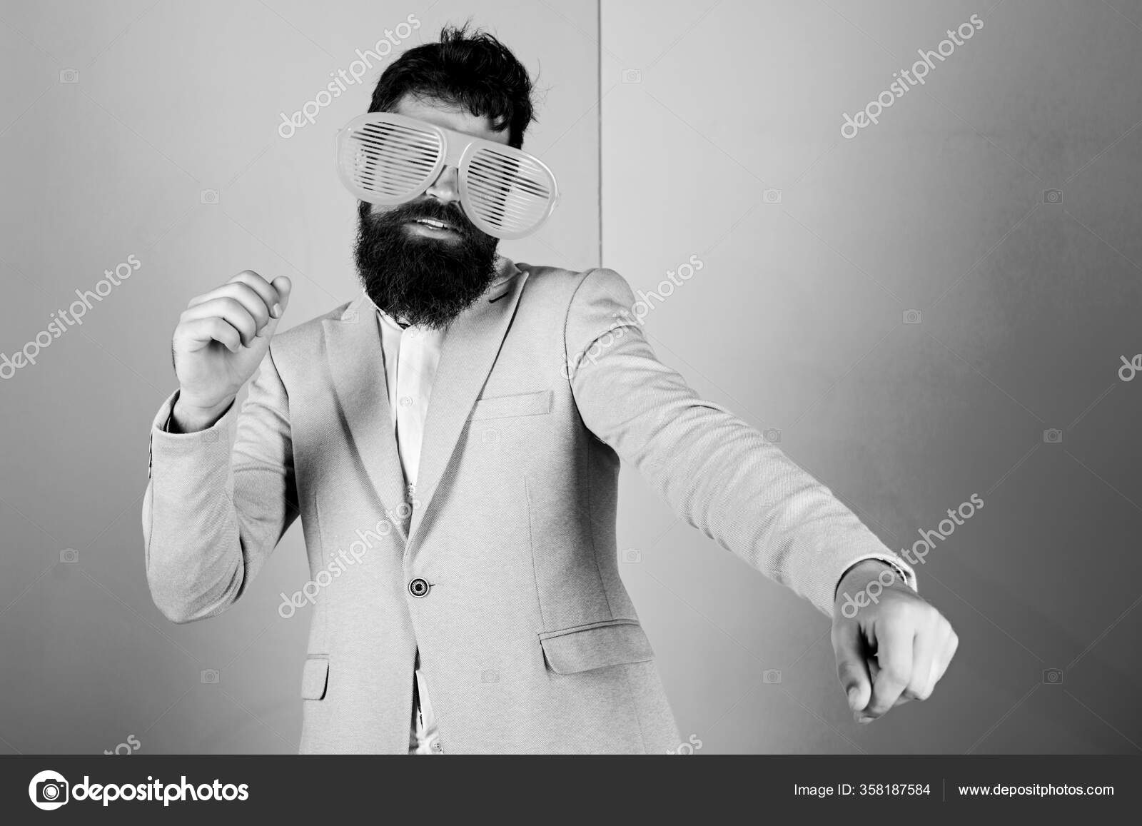 Diving into celebration. Man with long beard formal wear. Playful ...