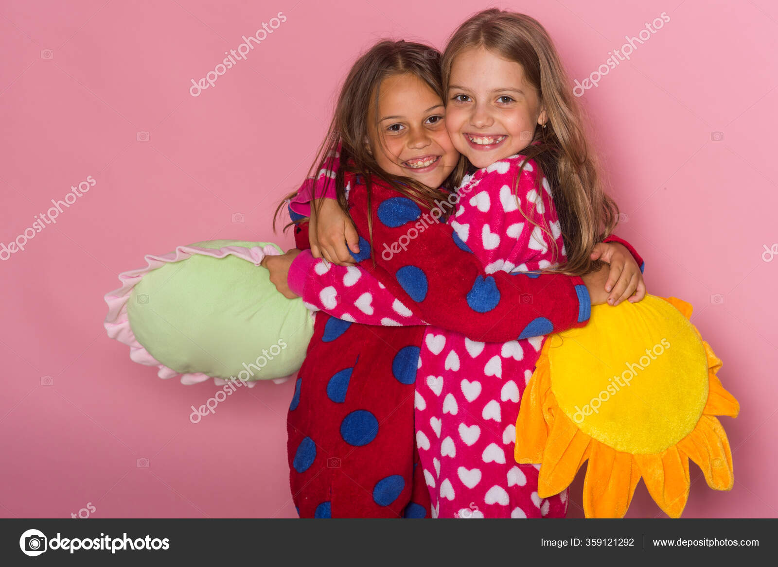Children with smiling faces hug. Girls in polka dotted pajamas Stock ...